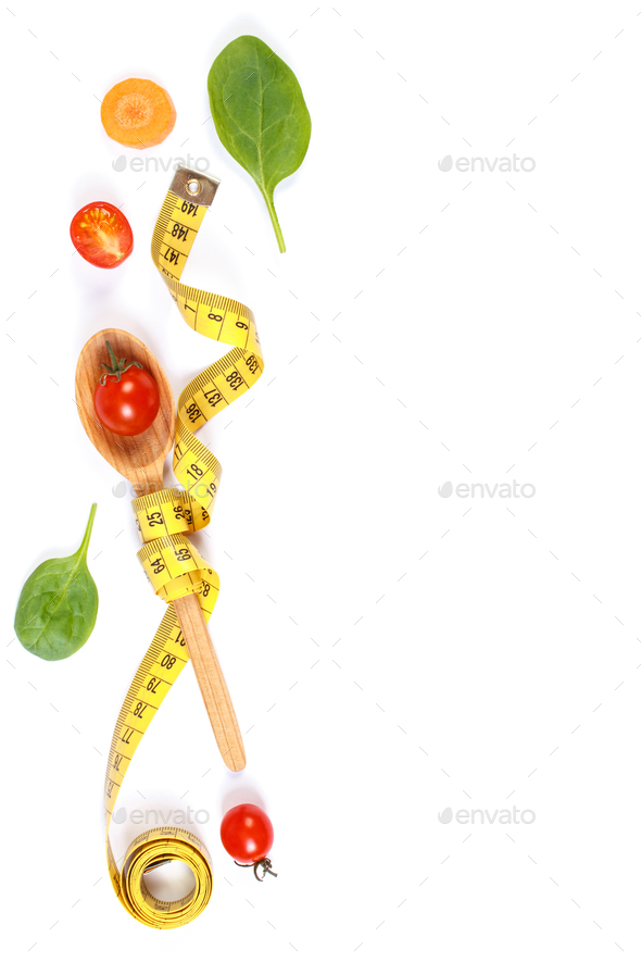 Spoon with centimeter and vegetables, slimming and healthy nutrition ...