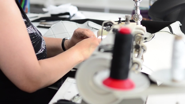 Seamstress Sews Product with Needle and Thread in Sewing Workshop ...
