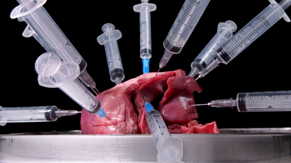 Heart Pricked with Syringe on Black Background, Stock Footage | VideoHive