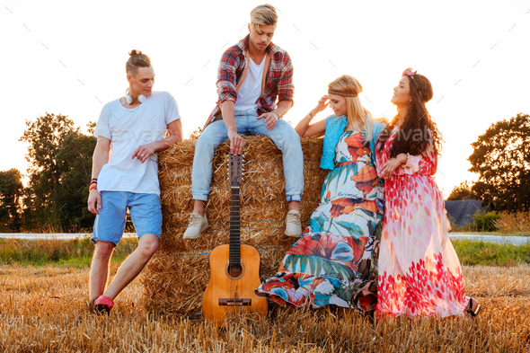 Hippie friends with guitar in a wheat field Stock Photo by Nejron ...
