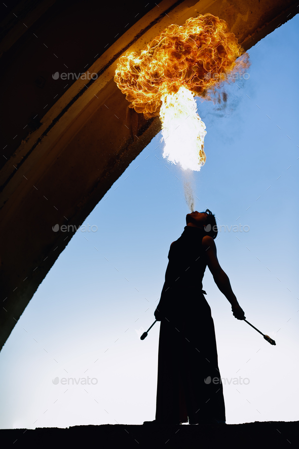 Fire artist performing extreme fire breathing Stock Photo by ...