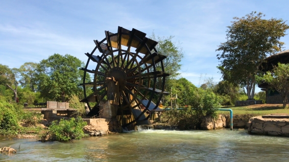 Working Watermill Wooden Wheel on a River with Falling Water in the ...