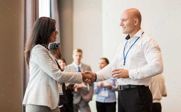handshake of people at business conference Stock Photo by dolgachov