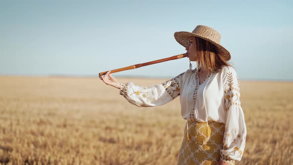 Woman Playing on Woodwind Wooden Flute Ukrainian Telenka or Tylynka in ...