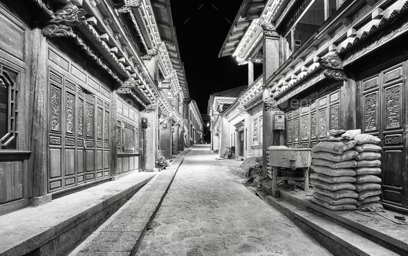 Illuminated empty street of Shangri La at night, China. Stock Photo by ...
