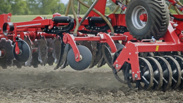 Sowing Machine Working on Farming Field. Farming Tractor with Trailer ...