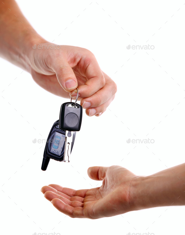 Male hand handing over key to another person Stock Photo by photobac