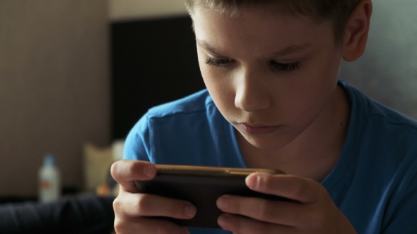 Boy with Mobile Phone Indoors, Stock Footage | VideoHive