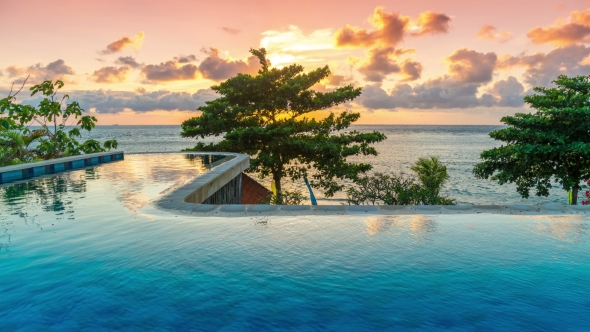 Exotic Romantic Sunrise Infinity Pool with Panoramic Sea Views, Stock ...