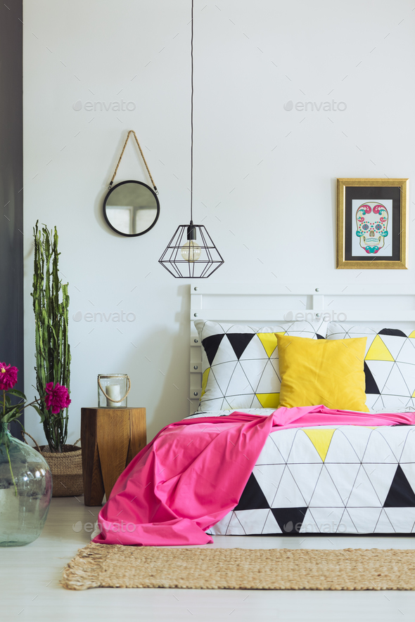 Geometric bedroom design, triangle quilt Stock Photo by bialasiewicz
