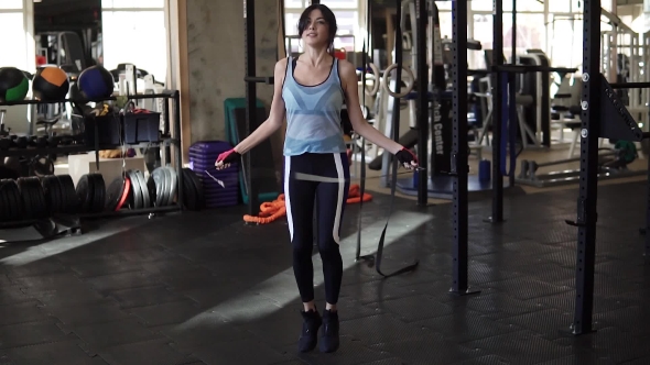 Skipping Woman Training at the Gym Working Out. Fit Young Woman ...