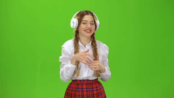 Girl Listens To Music on Headphones . Green Screen, Stock Footage ...