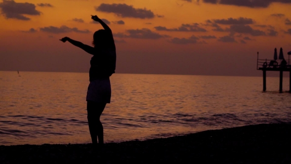 Beautiful Young Girl Is on the Beach During Sunset., Stock Footage