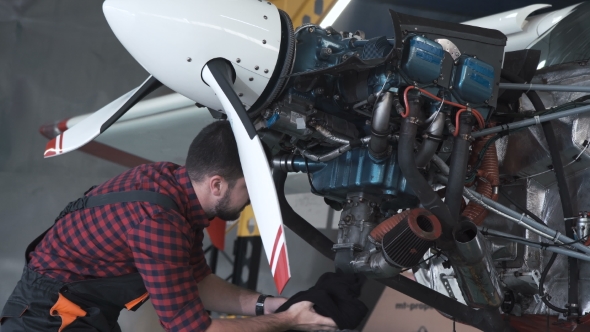 Man Cleaning Aircraft Engine in Hangar, Stock Footage | VideoHive