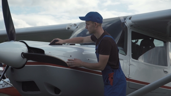 Young Pilot or Mechanic Working on an Aircraft, Stock Footage | VideoHive
