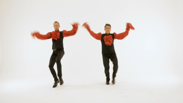 Two Men in Black Suits and Red Shirts Synchronously Dance, Stock Footage