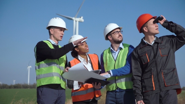 Four Engineers Standing in Open Field, Stock Footage | VideoHive