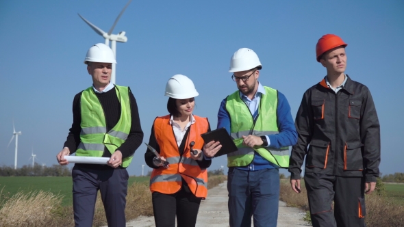 Engineers Walking Along Road Against Wind Turbines, Stock Footage ...