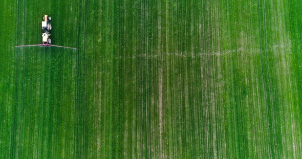 Farming. Agricultural Tractor Spraying Field, Stock Footage | VideoHive