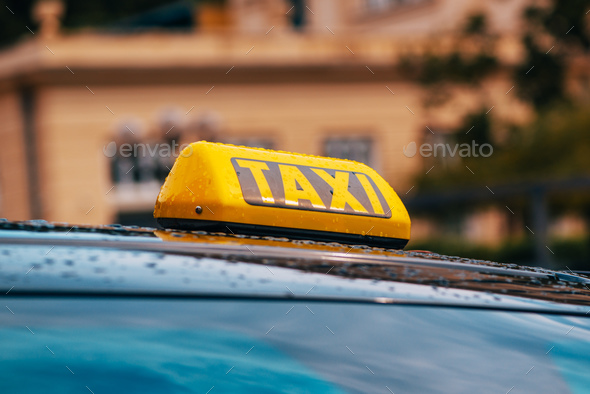 Yellow taxi sign on car roof Stock Photo by stevanovicigor | PhotoDune