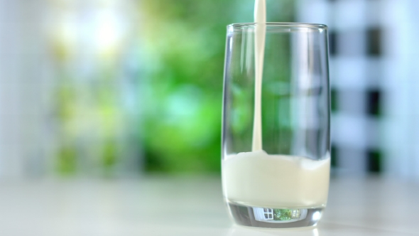 Pouring Fresh Milk From the Jug on Table, Stock Footage | VideoHive