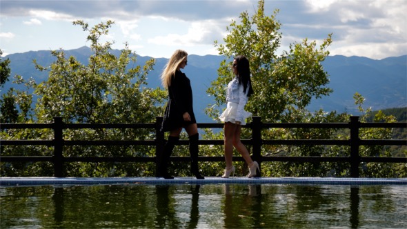 Girls Walk Around the Edge of the Pool, Stock Footage | VideoHive