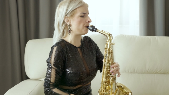 Jazz Saxophone Player Performing on the Sax in the Living Room, Stock ...