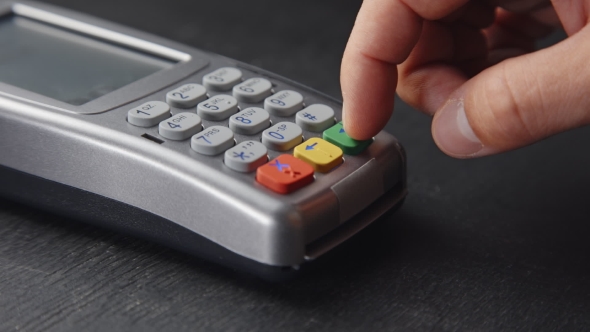 Person Pushing the Button and Swipe Credit Card Payment on Pos Terminal ...