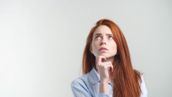 Thinking Redhead Girl Looking Up, Stock Footage | VideoHive