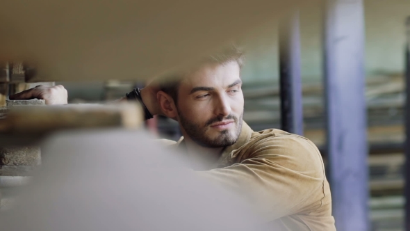 Thoughtful Male Model Stand in Poses in the Storage, Stock Footage