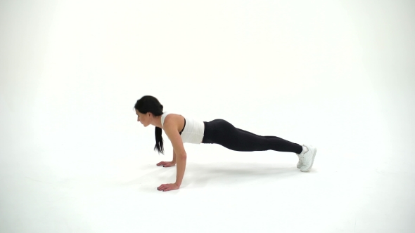 Athletic Young Beautiful Woman Brunette with Long Hair Push Ups in ...