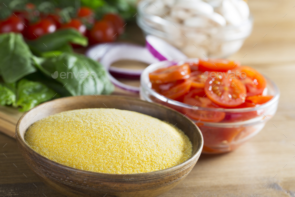 Raw Polenta and Sliced Tomatoes Stock Photo by charlotteLake | PhotoDune