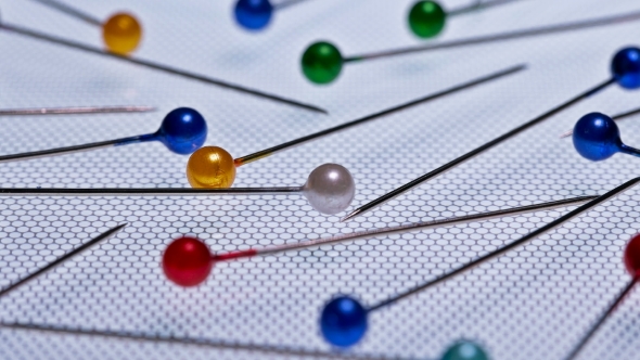 Lots of Needles with Beads on White Background, Stock Footage | VideoHive