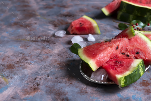Triangle shaped watermelon slices placed Stock Photo by lyulkamazur
