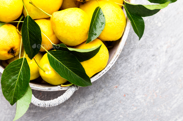 Yellow pear in grey basket in grey background. Harvest. Top view. Full ...