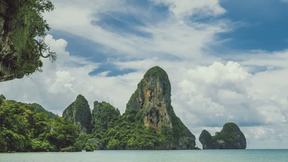 White Clouds Moving Above of the Limestone Cliff Rocks at Railay Beach ...