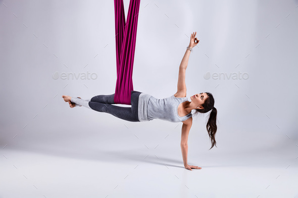 Aerial different inversion antigravity yoga in a hammock Stock Photo by ...