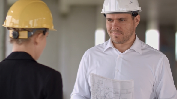 Handsome Architect with Supervisor of the Construction Site Show Place ...