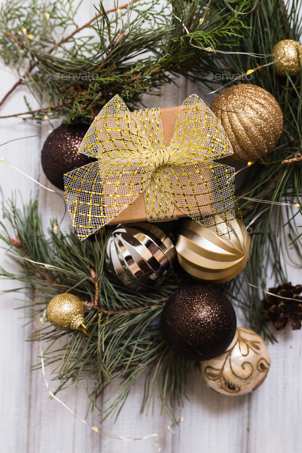 Christmas gift box with ribbon bow and branch christmas tree and ball ...