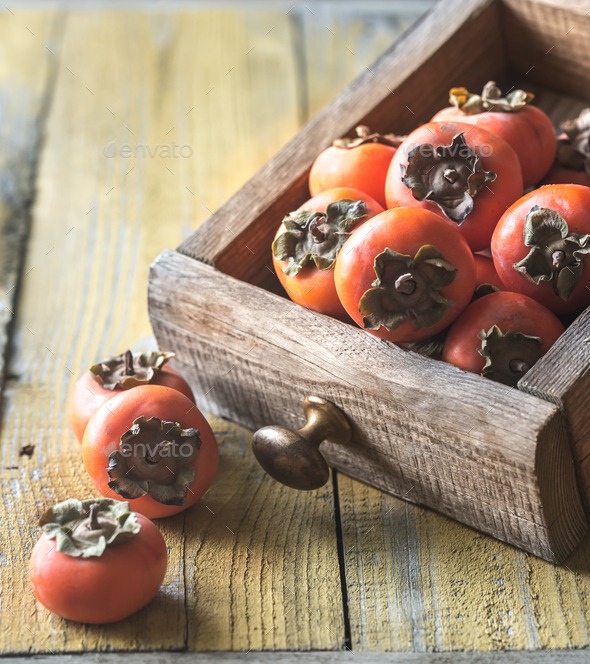 Wooden box of fresh persimmons Stock Photo by Alex9500 | PhotoDune