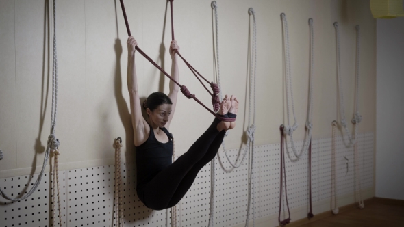 Beautiful Brunette Woman Is Hanging on the Ropes Leaning Agains the ...