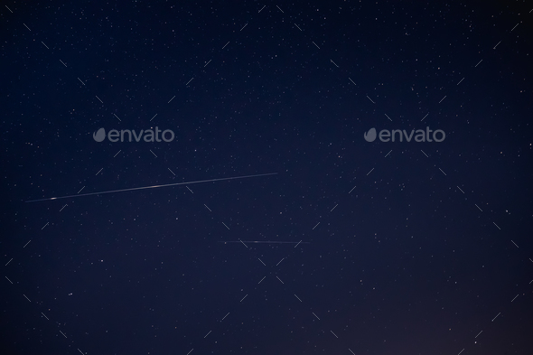 Two Meteoric Tracks In The Blue Night Starry Sky Background. Nat Stock ...