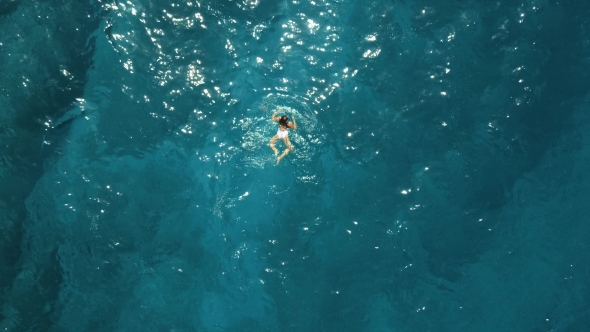 Girl in a White Swimsuit Swimming in the Blue Sea, Stock Footage ...