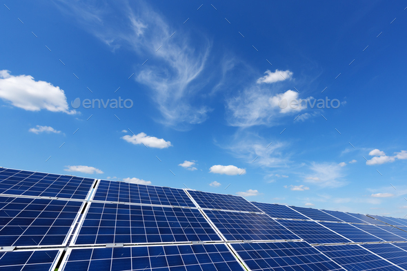 Solar panel on blue sky background Stock Photo by ivankmit | PhotoDune