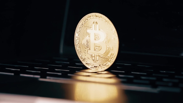 Bitcoin Coin Falling Down on the Laptop Keyboard, Motion Graphics ...