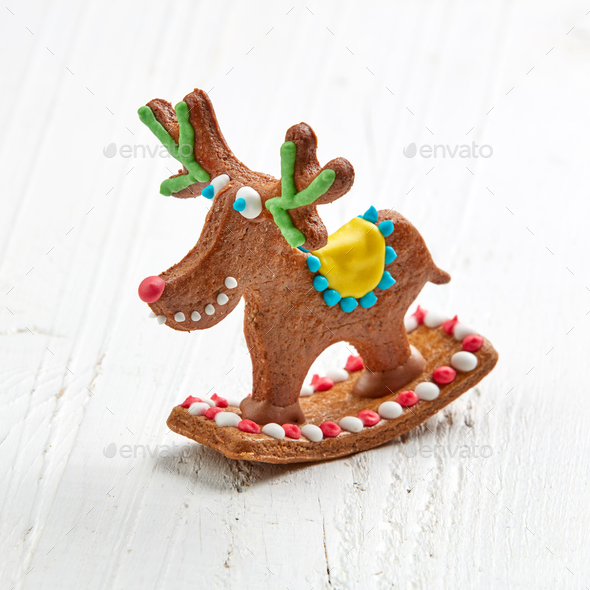 gingerbread deer on white wooden table Stock Photo by magone | PhotoDune