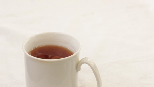 Pour Into a Cup of Tea Sugar with a Teaspoon, Stock Footage | VideoHive