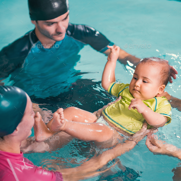 Baby swimming class Stock Photo by microgen | PhotoDune