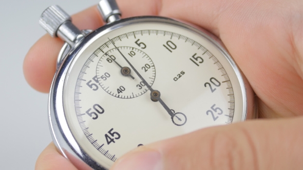 One Person Starting Up a Stopwatch at White Background, Stock Footage