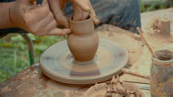 Hands Shaping a Clay Pot on Pottery Wheel., Stock Footage | VideoHive
